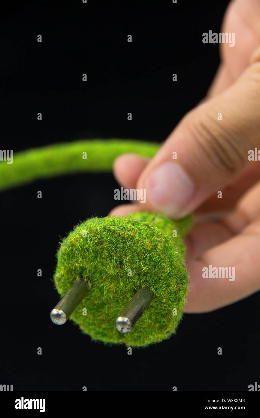 abstract image of green electric plug Stock Photo - Alamy