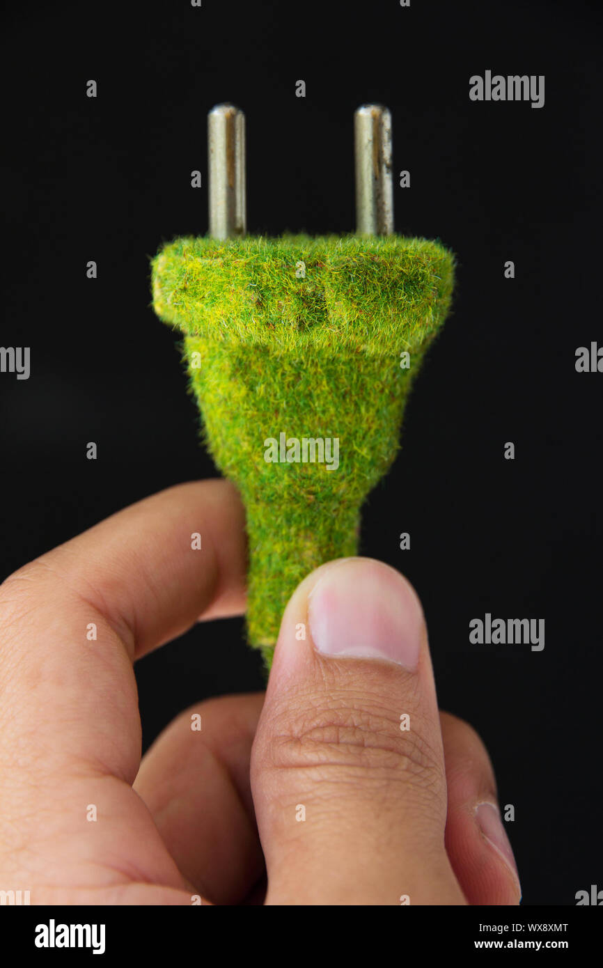 abstract image of green electric plug Stock Photo - Alamy