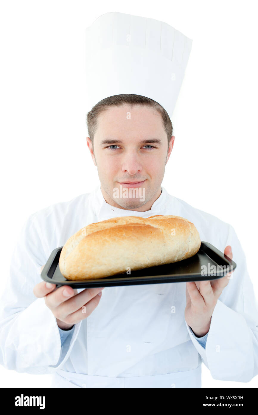Charismatic male cook holding a bread into the camera against white ...