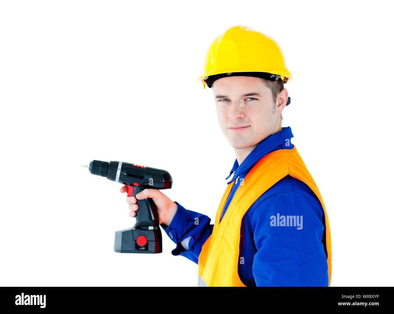 Assertive male worker holding a tool looking at the camera against ...