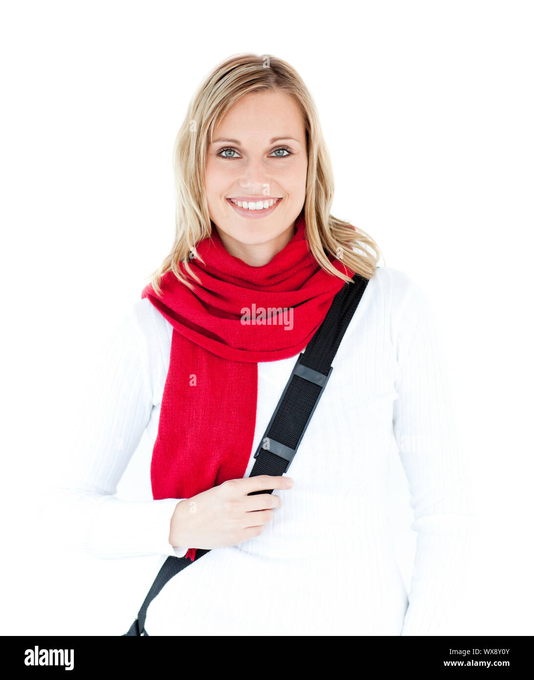 Portrait of a delighted student with scarf smiling at the camera ...