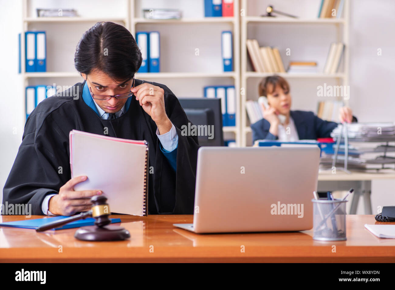 Two lawyers working in the office Stock Photo - Alamy
