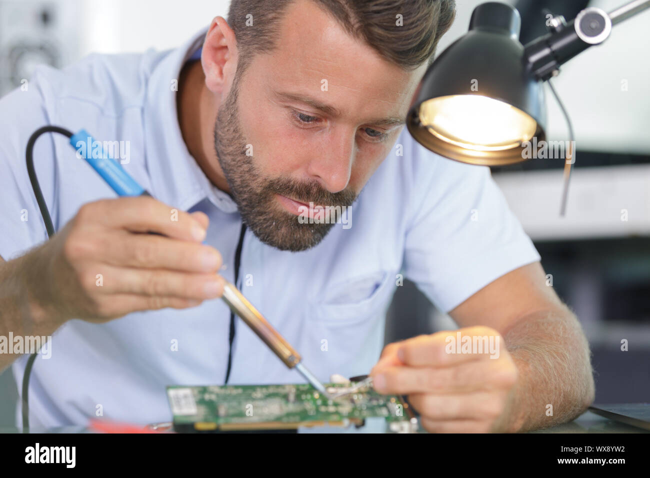 engineer working on circuit board Stock Photo - Alamy