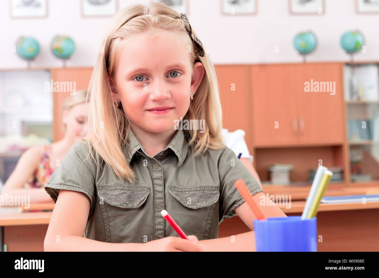 portrait of students in the classroom, sit at school desks Stock Photo ...