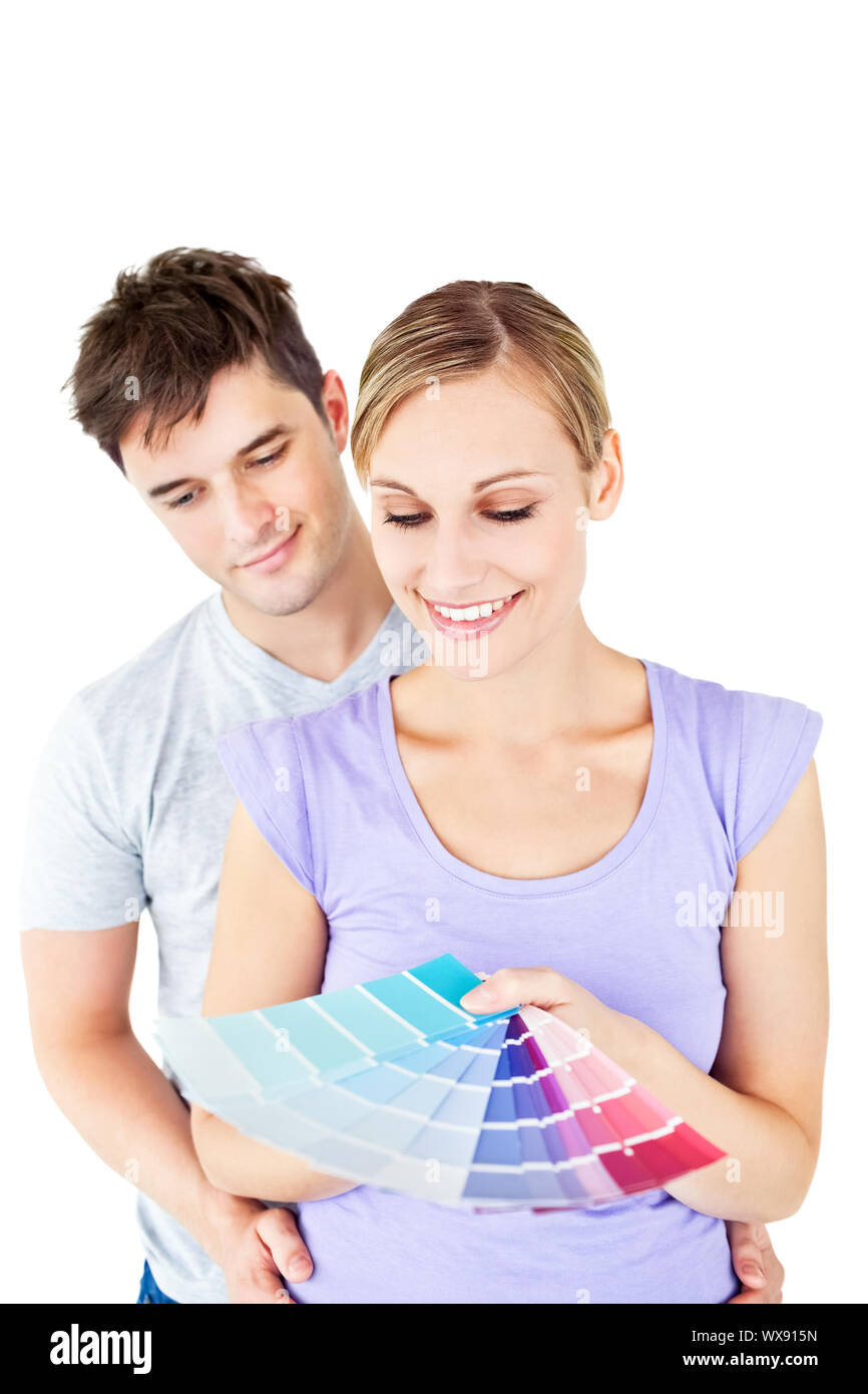 Enamored couple choosing color for a room in their new house Stock ...