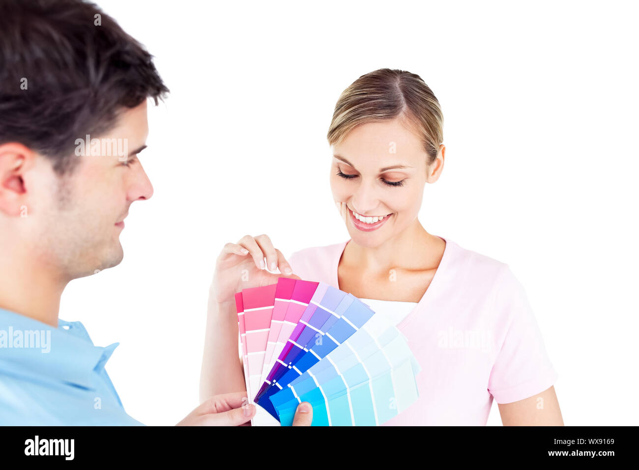Delighted couple choosing color for a room in their new house Stock ...