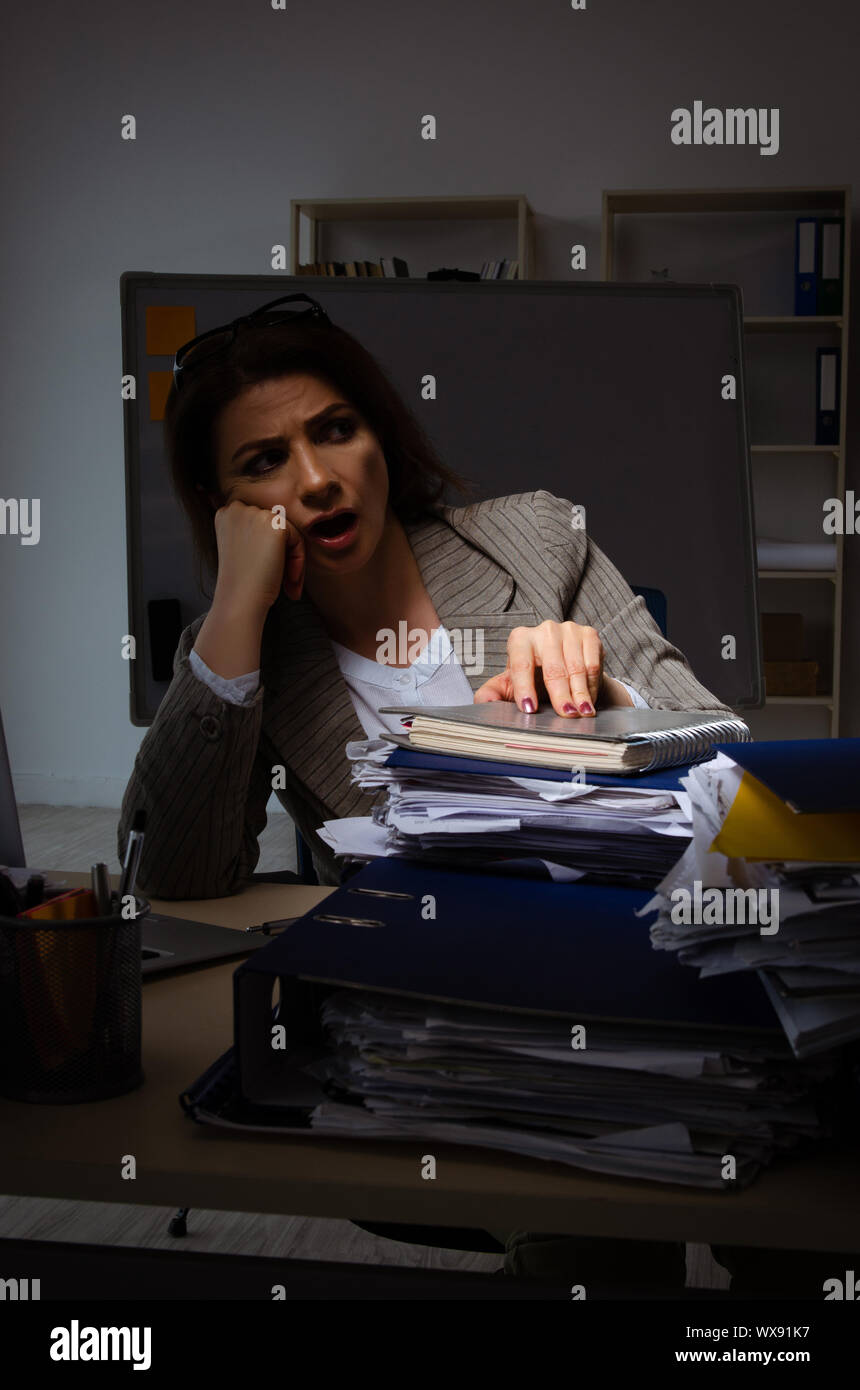 Female employee suffering from excessive work Stock Photo - Alamy