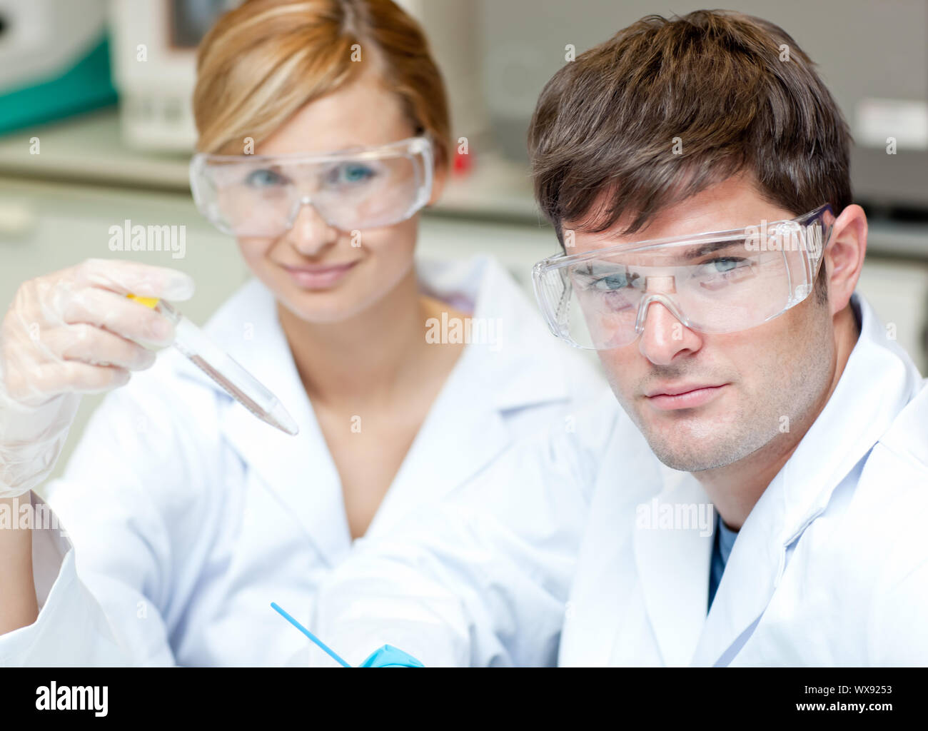 Two caucasian scientists doing experiments in their laboratory Stock ...