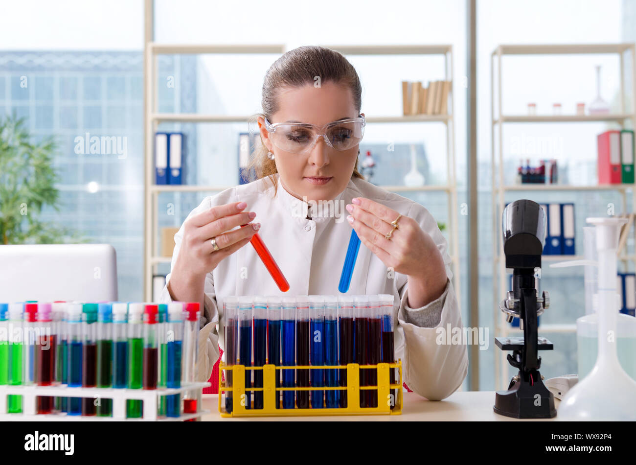 Female chemist working in medical lab Stock Photo - Alamy