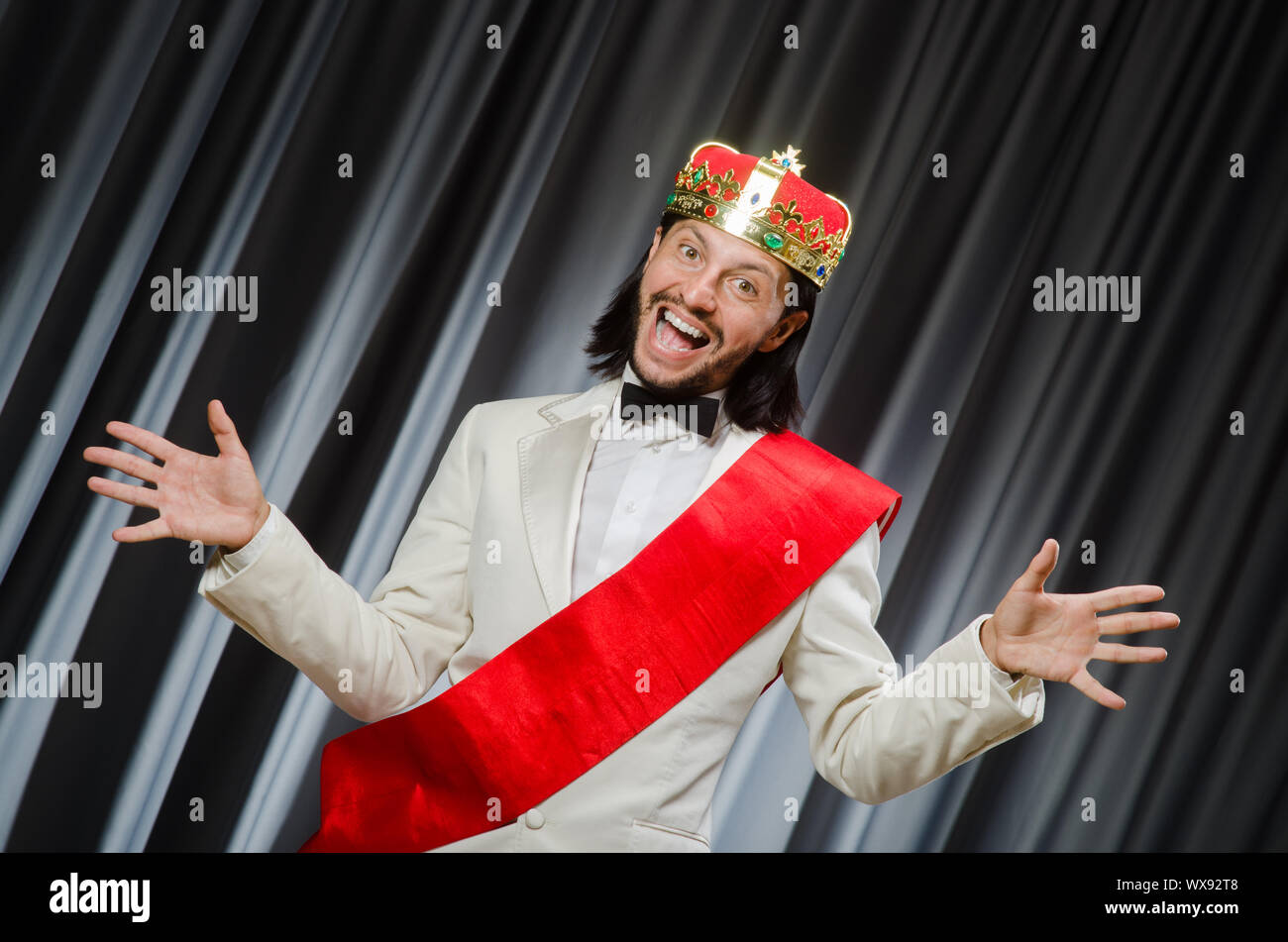 Funny king wearing crown in coronation concept Stock Photo - Alamy