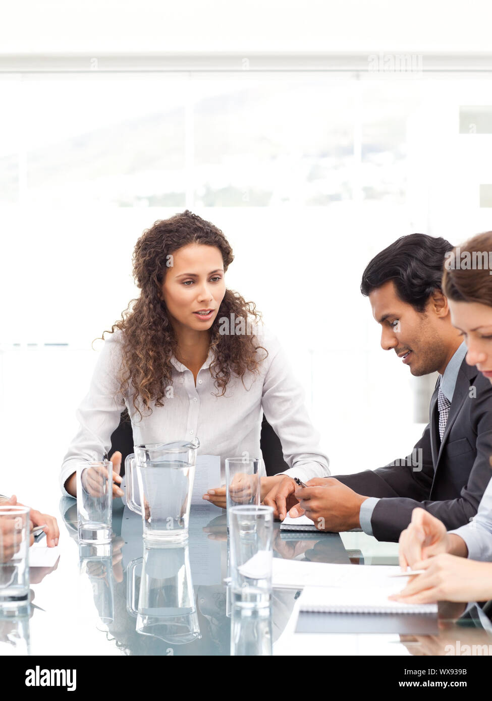 Business team working together around a table during a meeting Stock ...