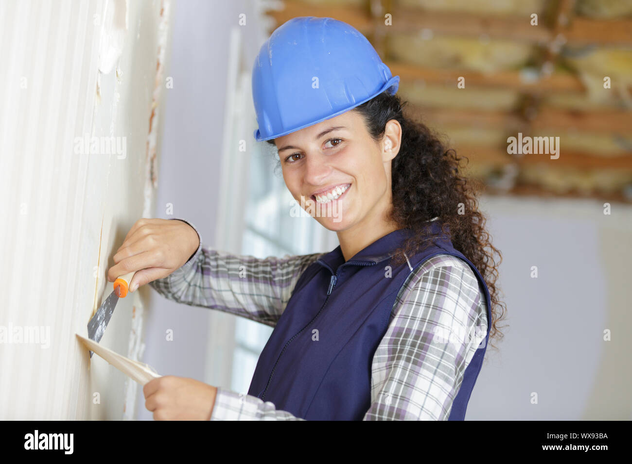 Woman wallpaper stripping hi-res stock photography and images - Alamy