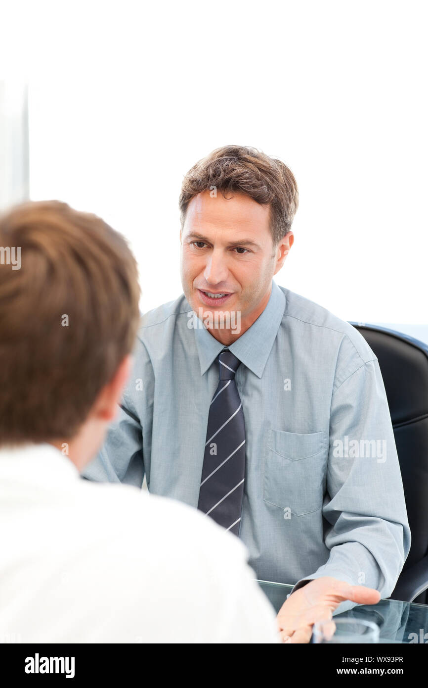 Serious manager talkin witthh anemployee during an interview at the ...