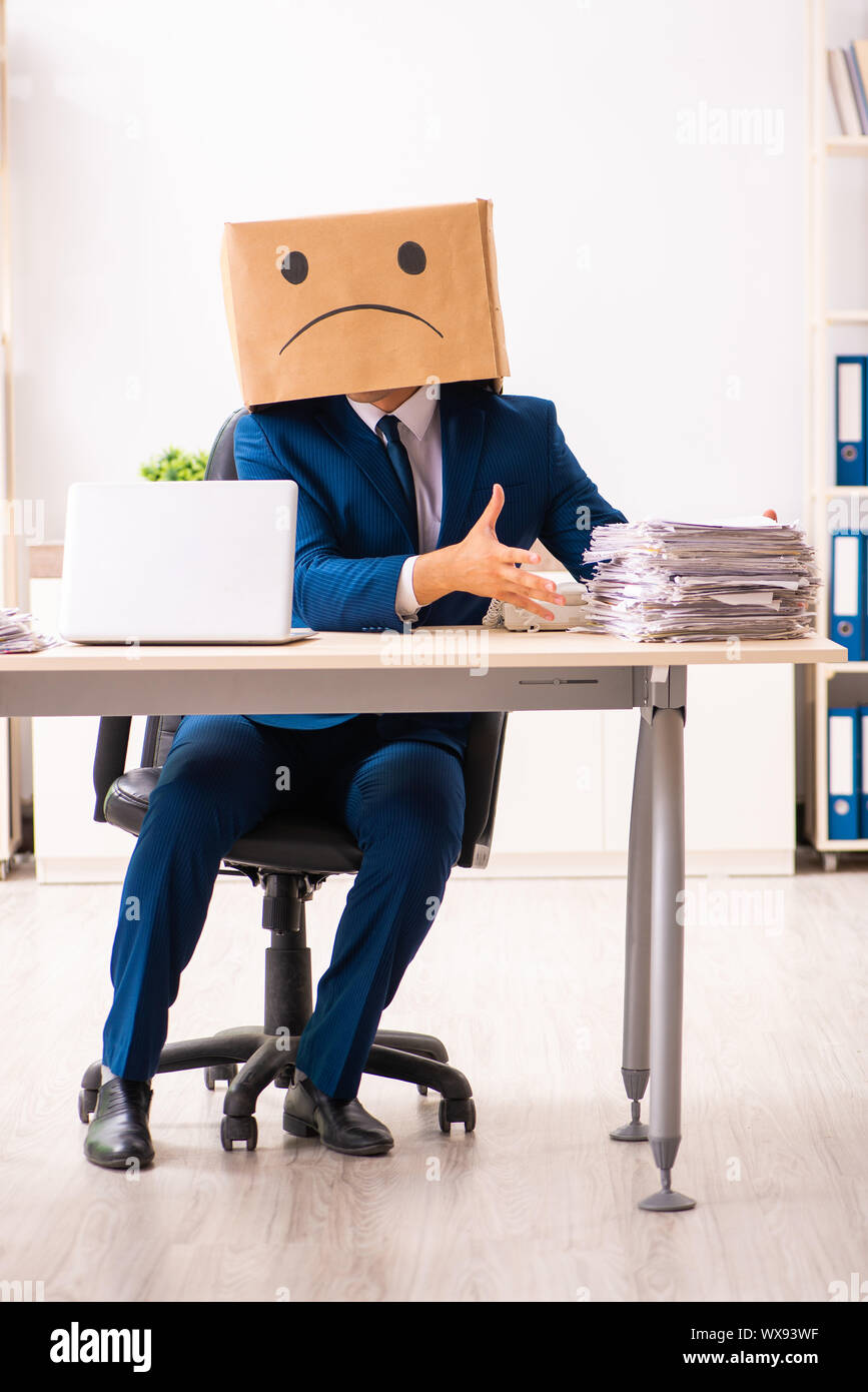 Unhappy man employee with box instead of his head Stock Photo - Alamy