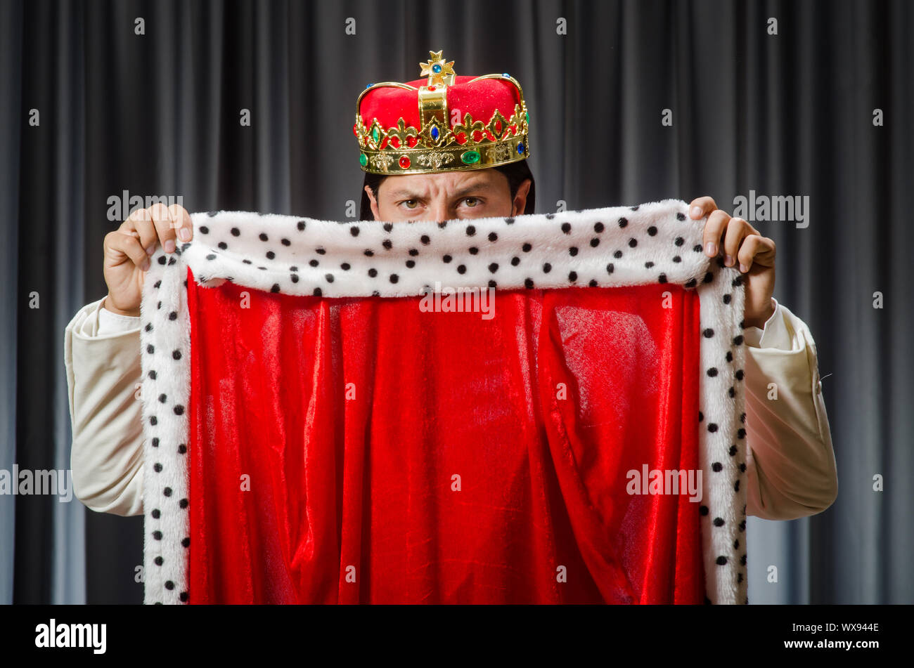 Funny king wearing crown in coronation concept Stock Photo - Alamy