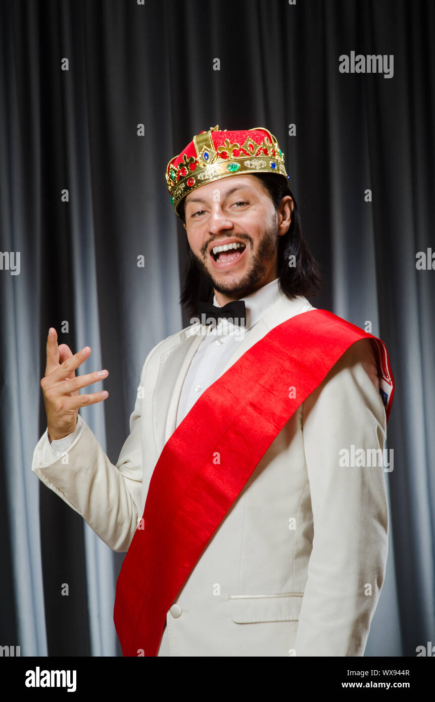 Funny king wearing crown in coronation concept Stock Photo - Alamy