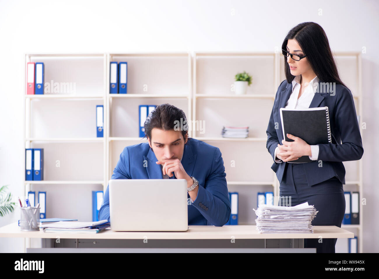 Two concentrated employees working hi-res stock photography and images ...