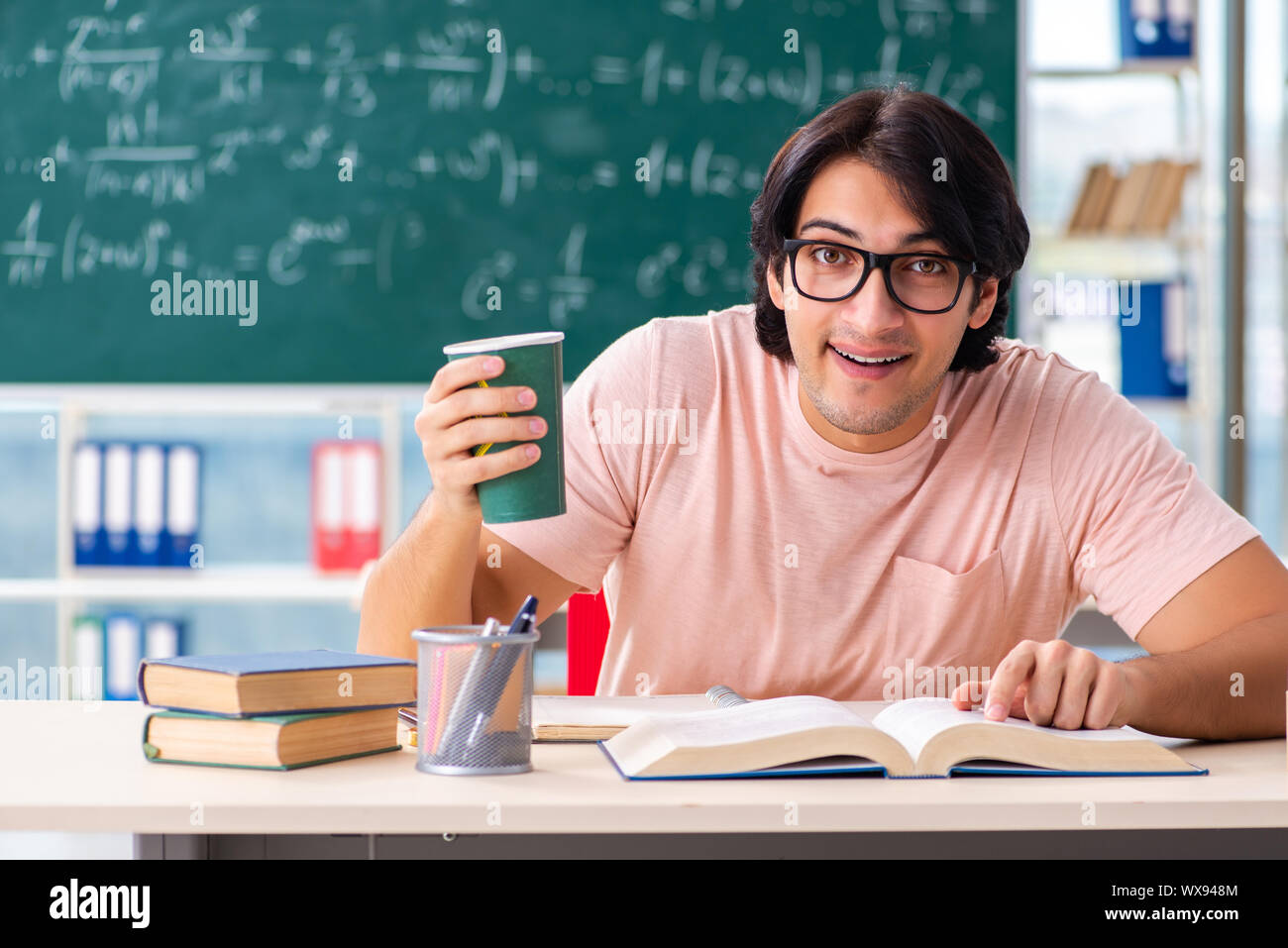 Young male student in the classroom Stock Photo - Alamy