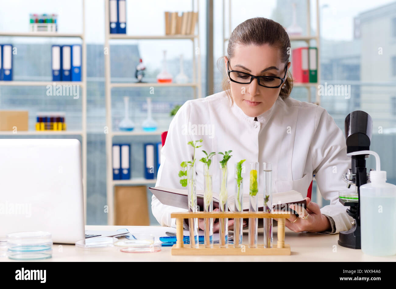 Female biotechnology scientist chemist working in the lab Stock Photo ...