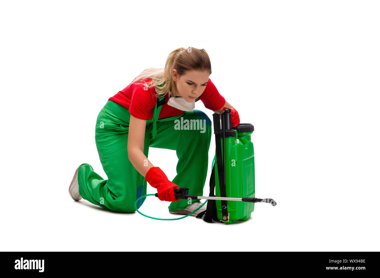 Female pest control contractor isolated on white Stock Photo - Alamy