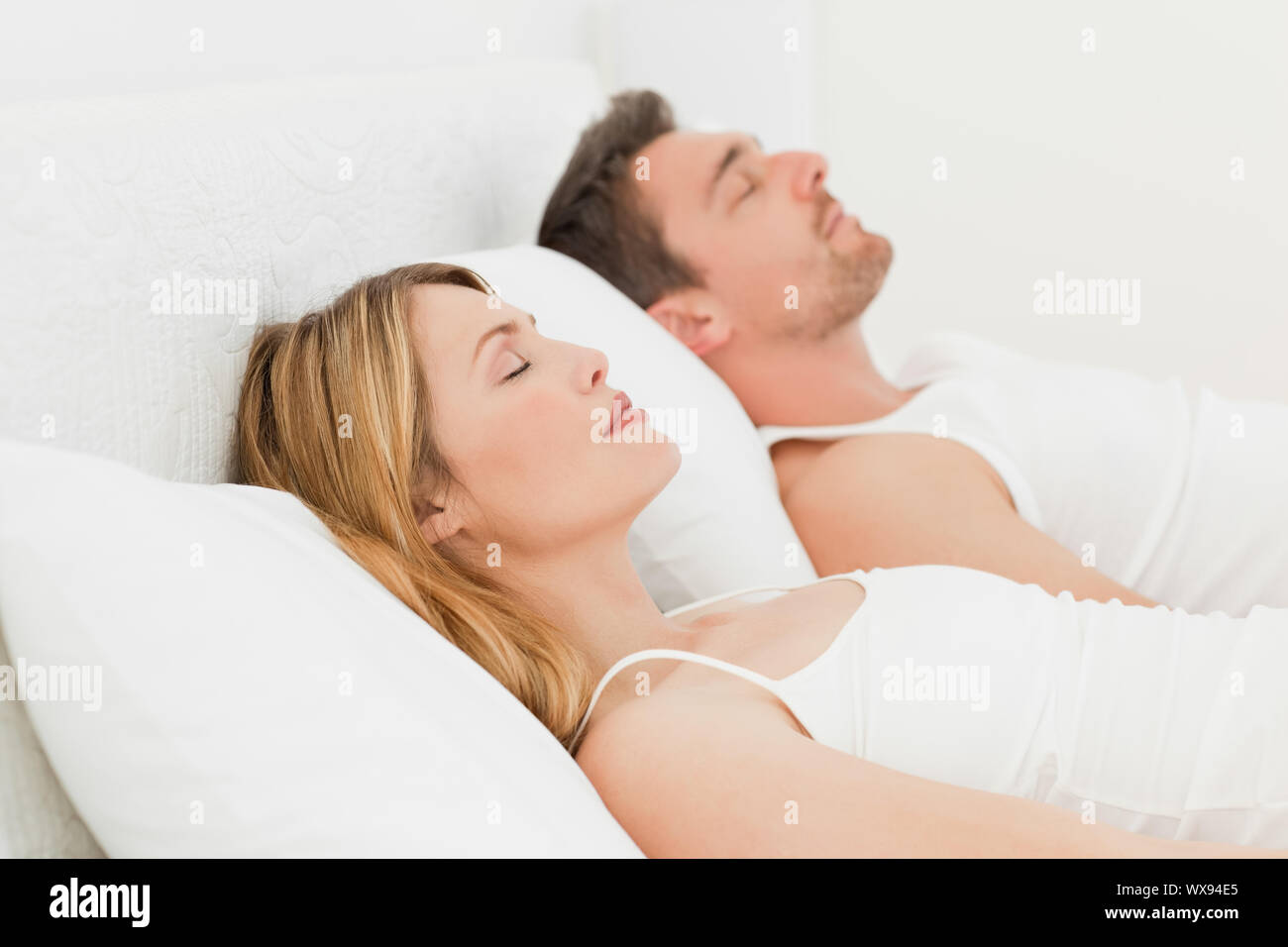 Calm pairs sleeping together at home Stock Photo - Alamy