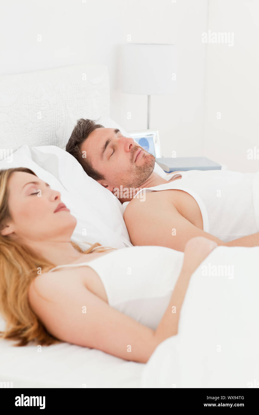 Happy pair in their bed in their bedroom Stock Photo - Alamy