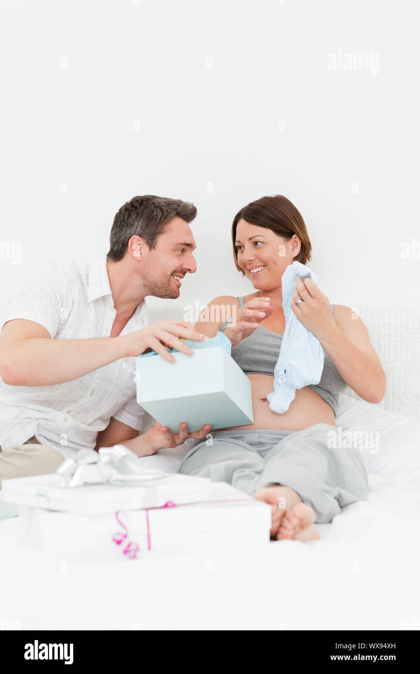 Woman offering a gift to her wife at home Stock Photo - Alamy