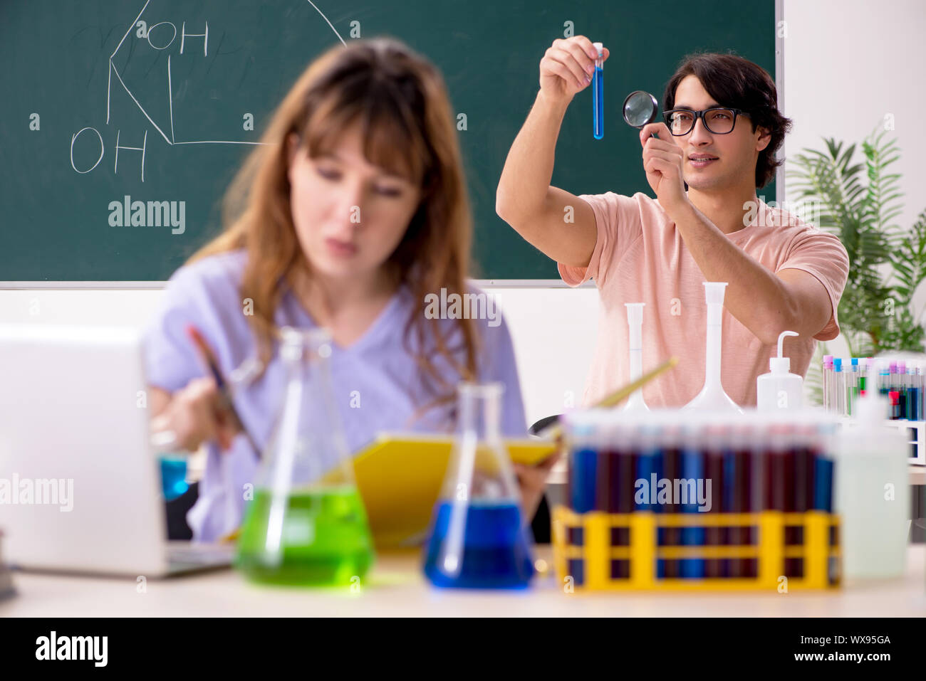 Two chemists students in classroom Stock Photo - Alamy