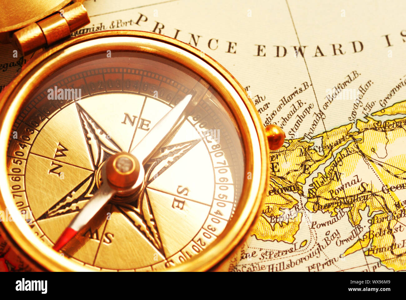 Antique brass compass over old Canadian map background Stock Photo - Alamy