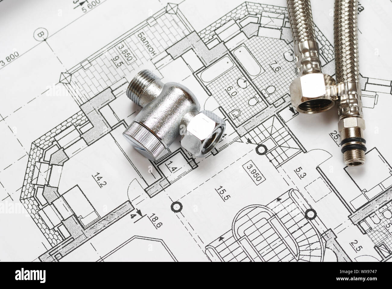 Pipes over house plan blueprints Stock Photo - Alamy