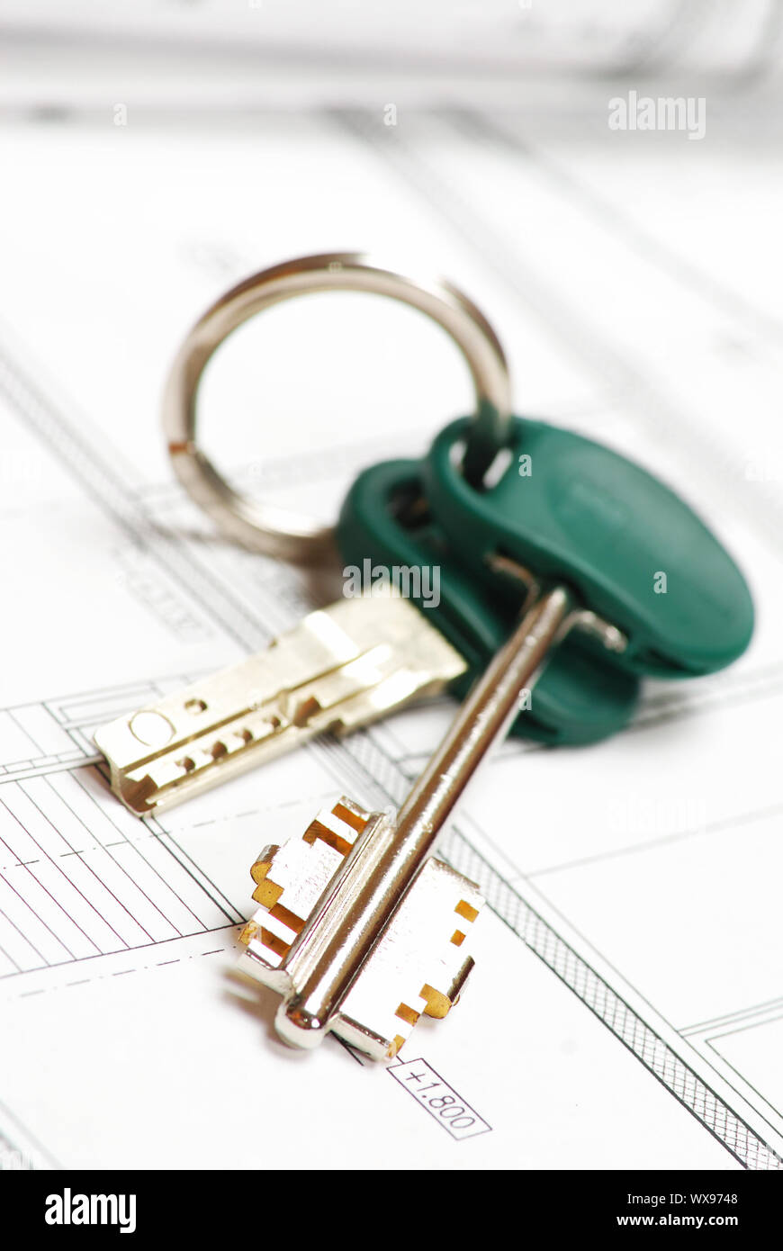 Keys over house plan blueprints Stock Photo - Alamy