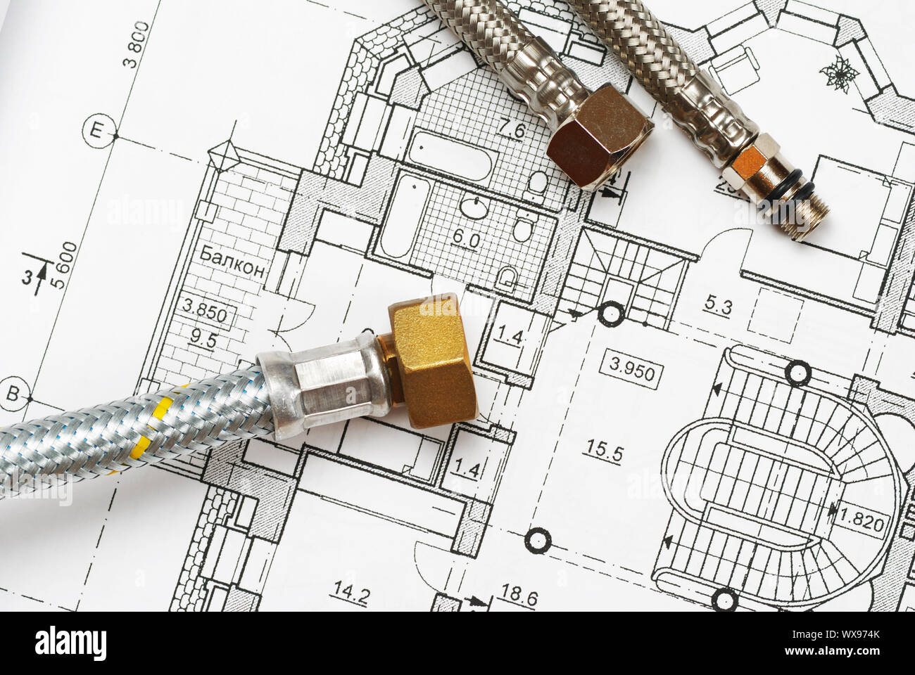 Pipes over house plan blueprints Stock Photo - Alamy