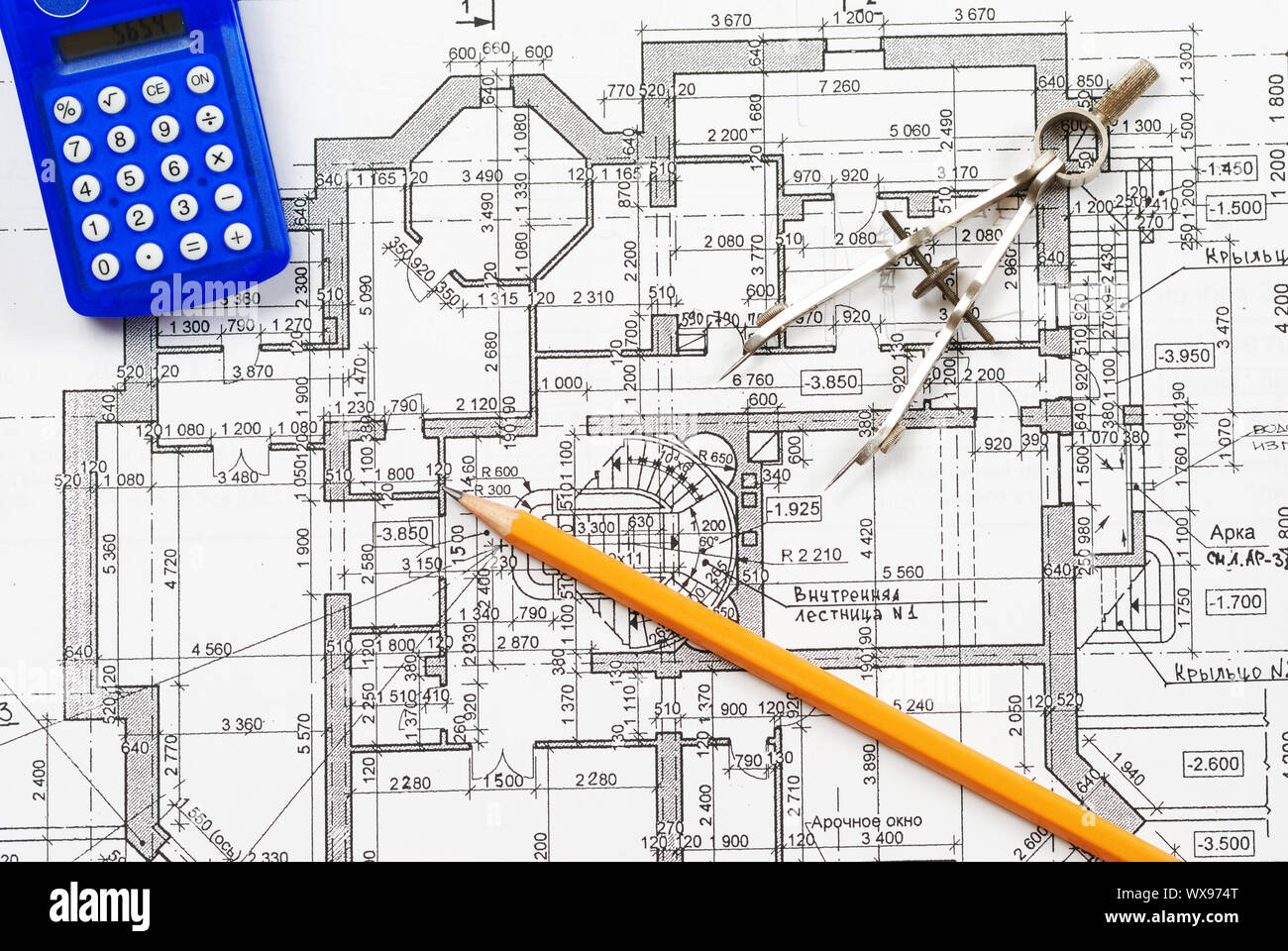 Tools over house plan blueprints Stock Photo - Alamy