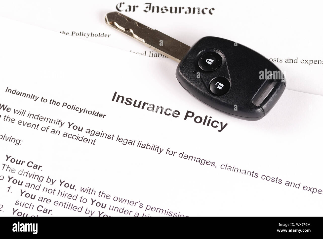Car key on an insurance policy Stock Photo - Alamy