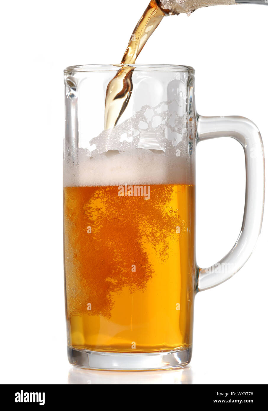 Beer mug isolated on white. Pouring beer in it Stock Photo - Alamy