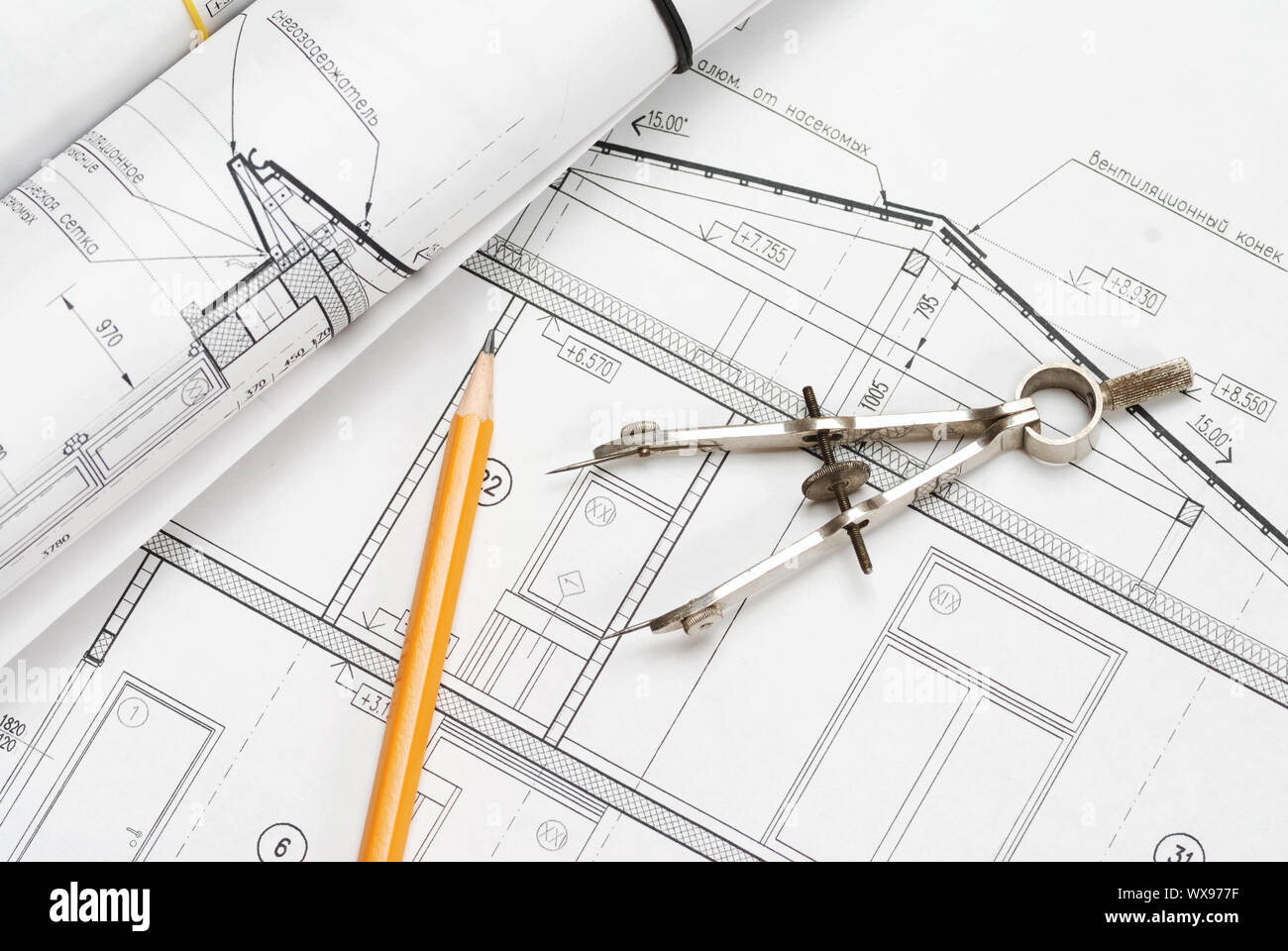 Tools over house plan blueprints Stock Photo - Alamy