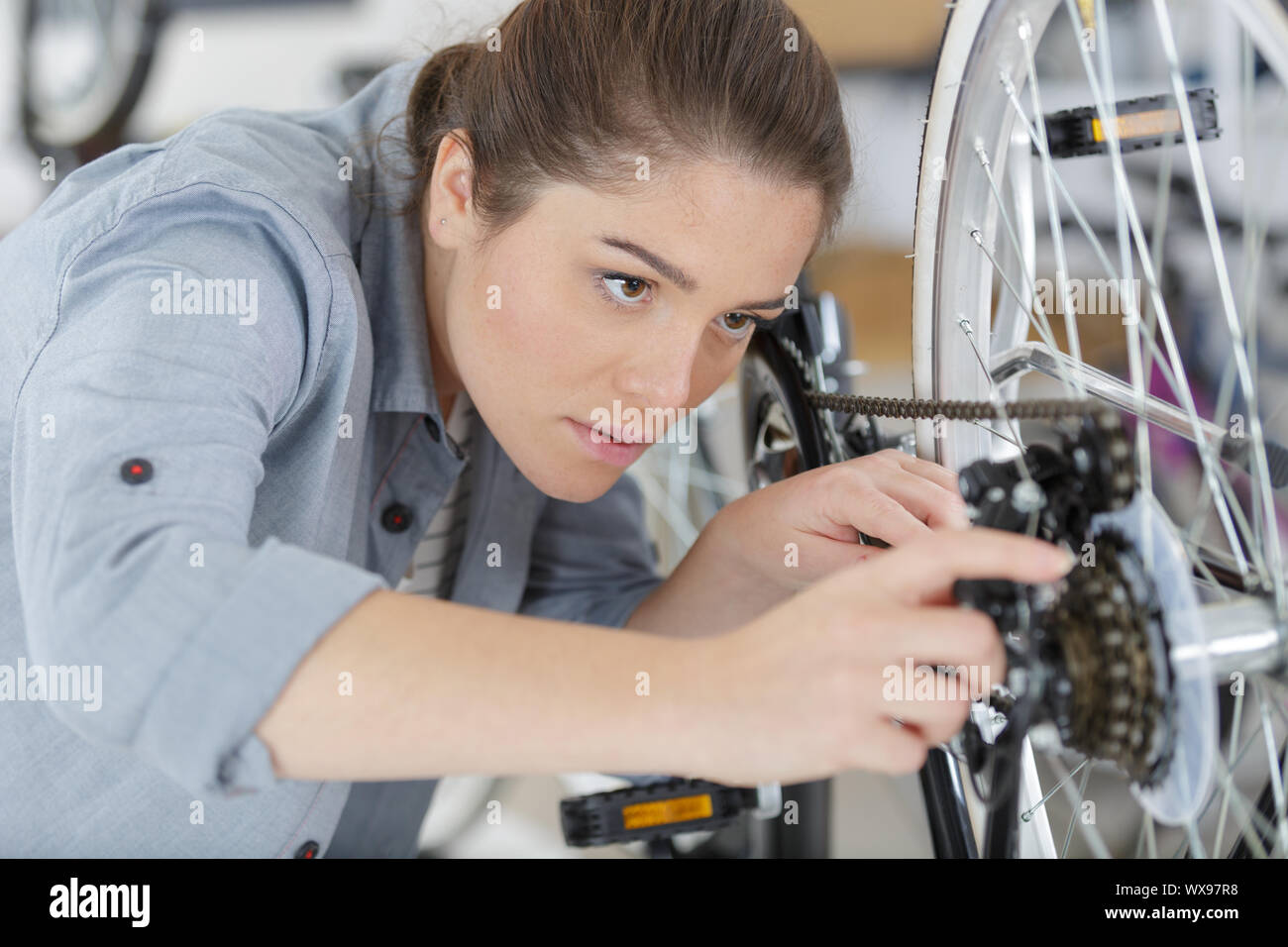 Girl fixing bike hi-res stock photography and images - Alamy