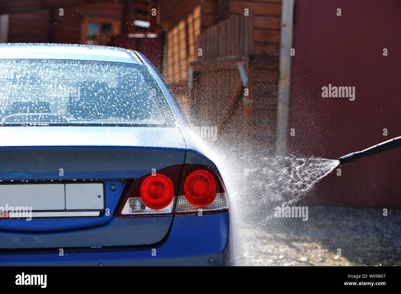 Blue car washing on open air Stock Photo - Alamy