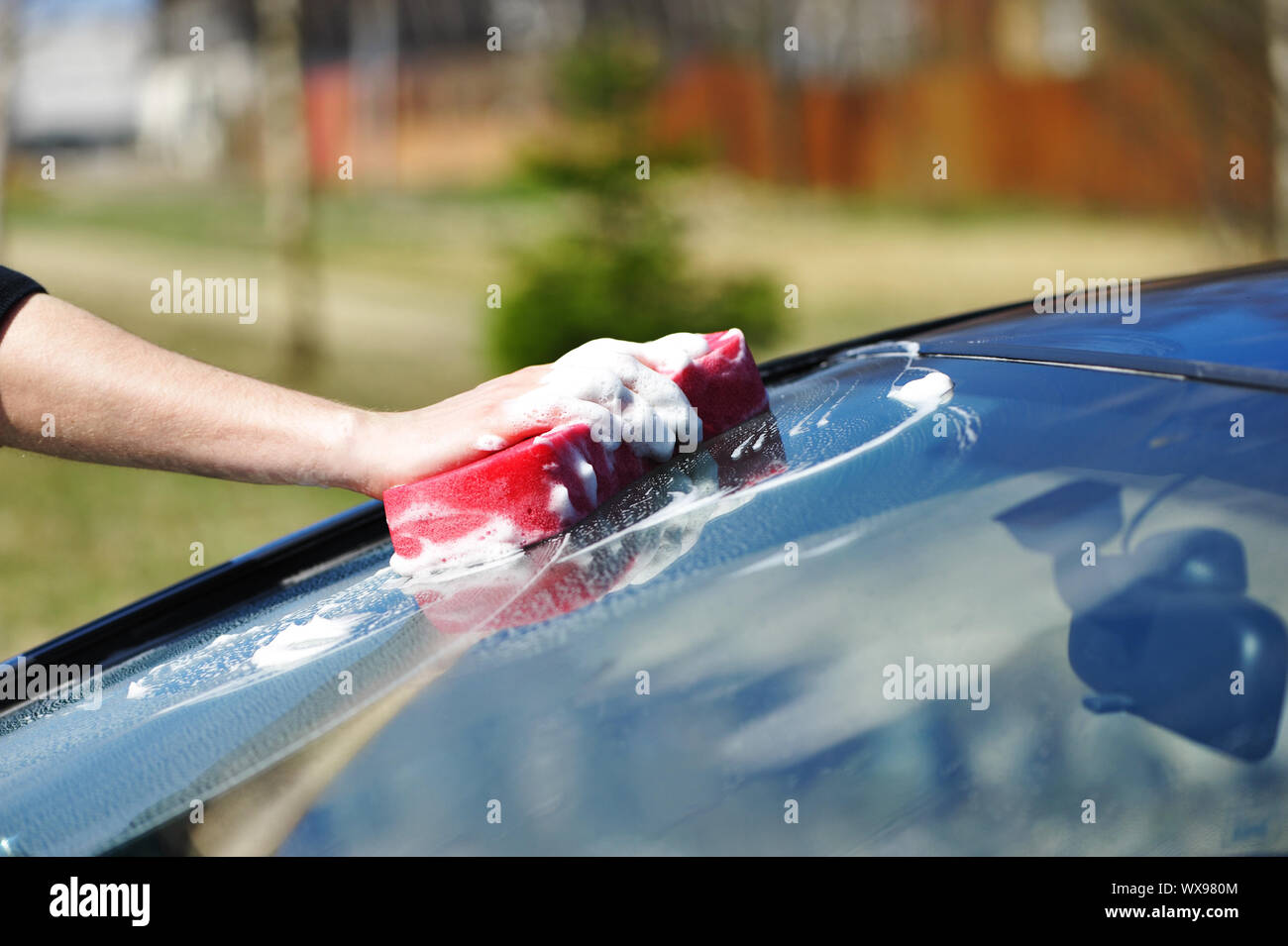 Blue car washing on open air Stock Photo - Alamy