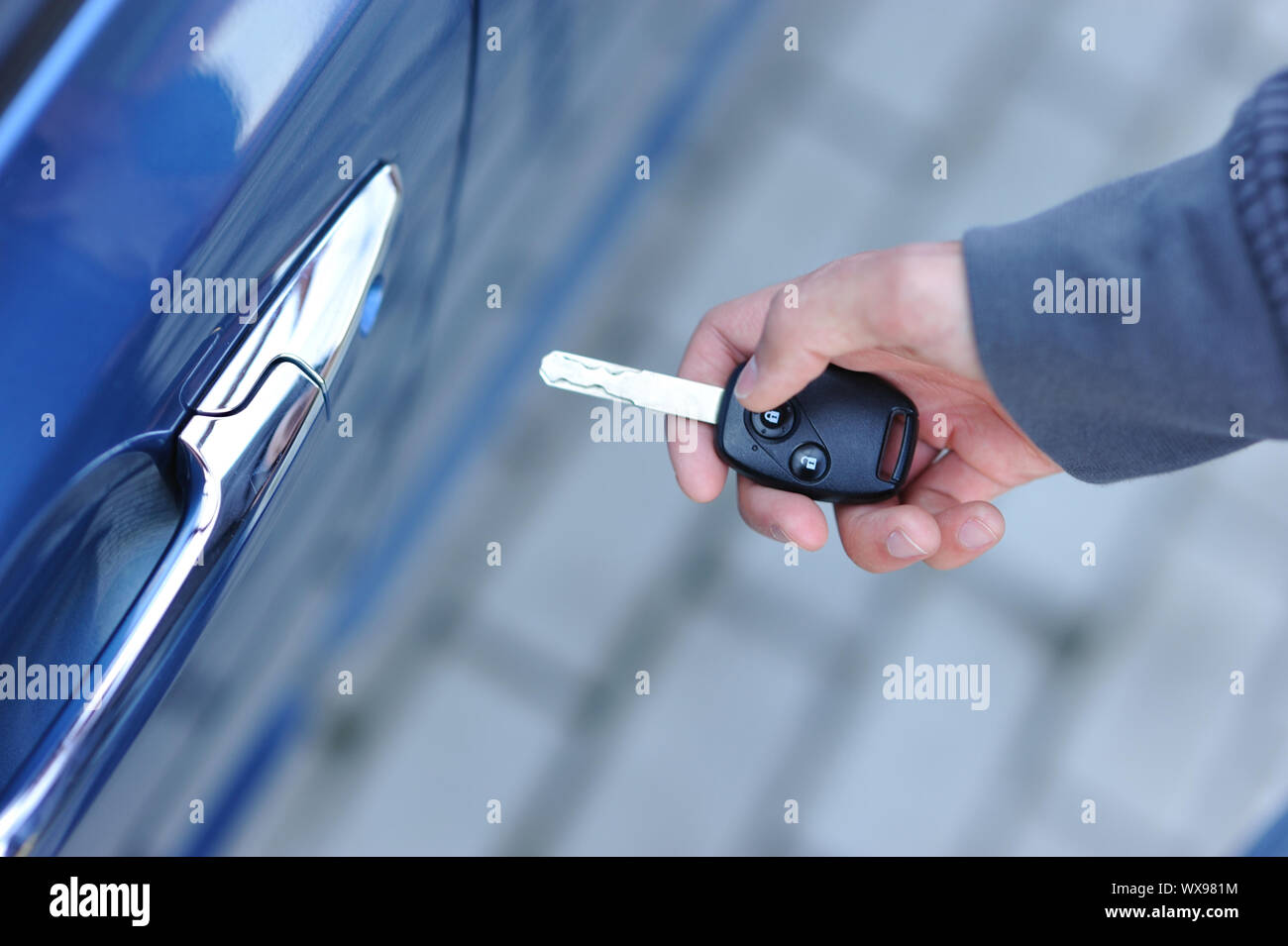 Car key in man's hand Stock Photo - Alamy