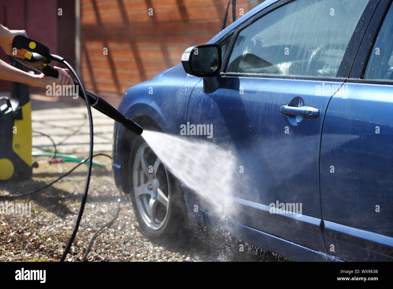 Blue car washing on open air Stock Photo - Alamy