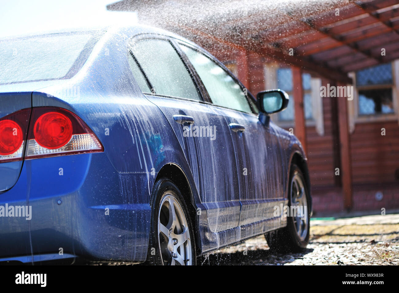 Blue car washing on open air Stock Photo - Alamy