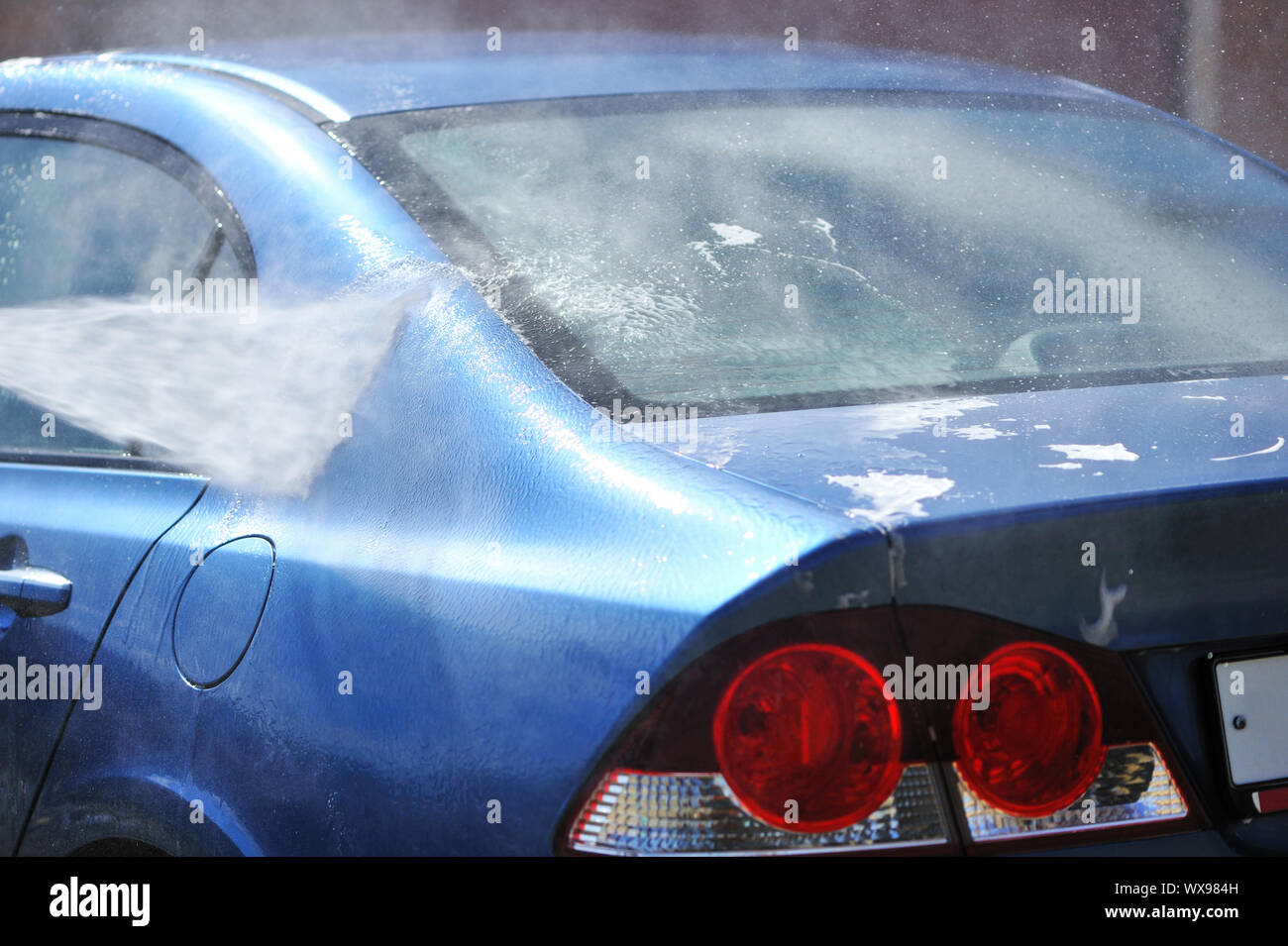 Blue car washing on open air Stock Photo - Alamy