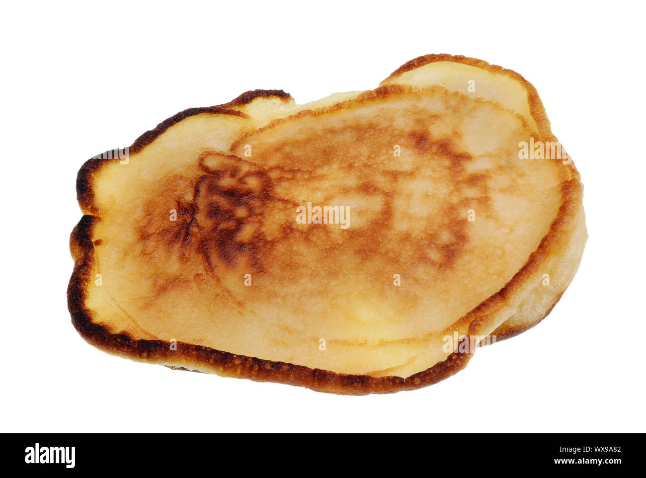 The first ugly fried pancake concept isolated on white macro Stock ...