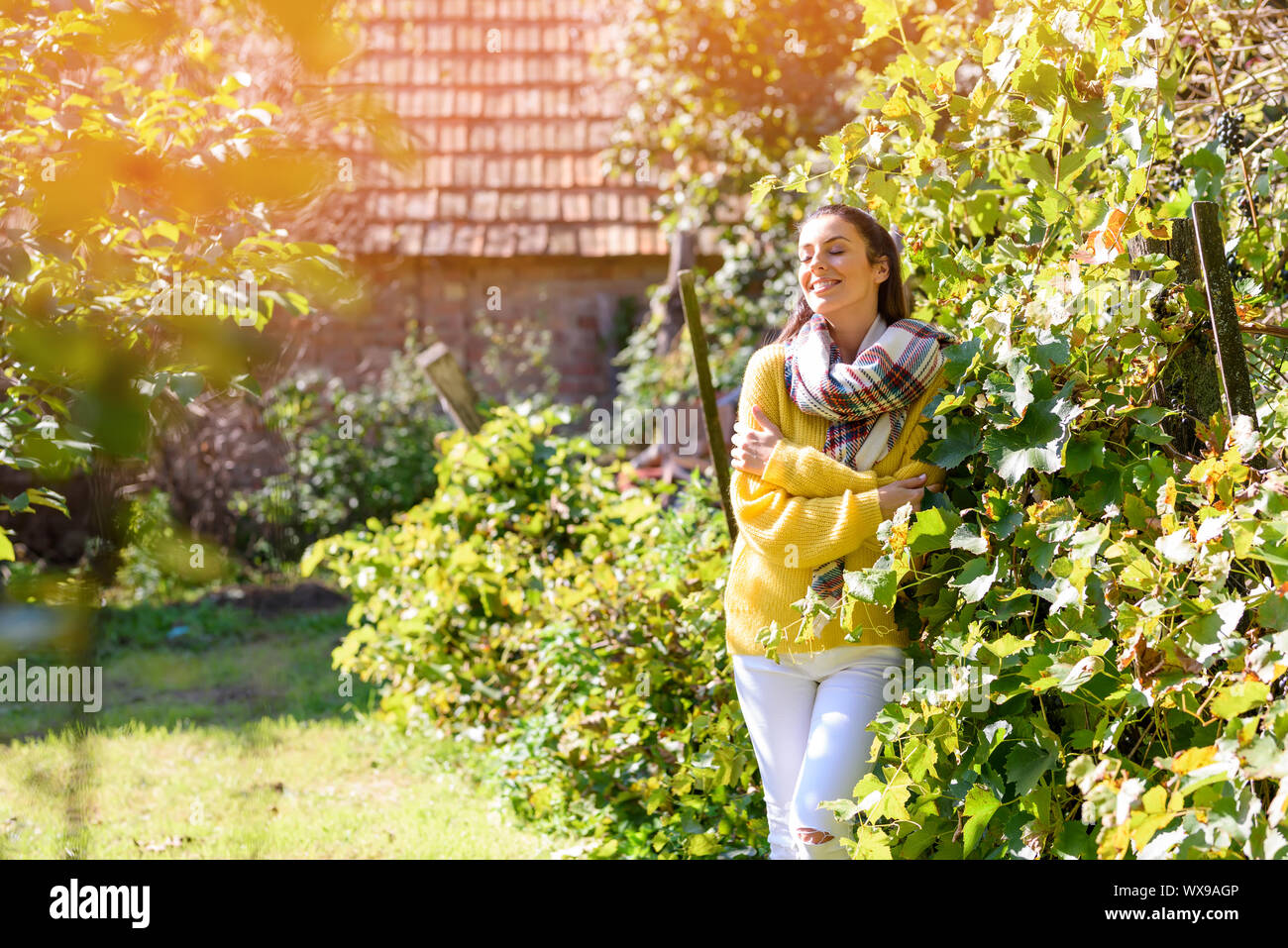 A beautiful woman enjoying the sunlight during Autumn Stock Photo - Alamy