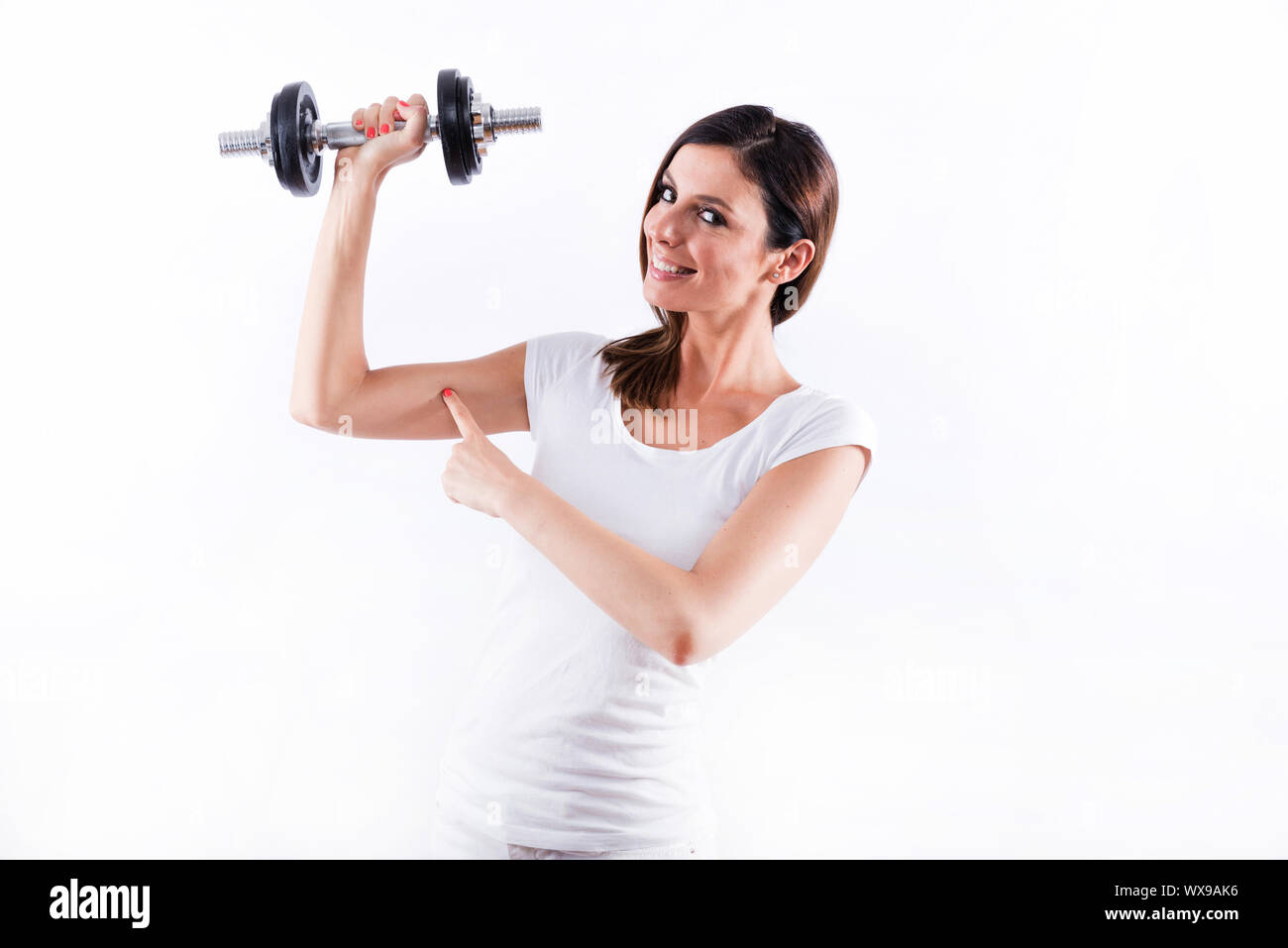 Athletic woman showing muscles hi-res stock photography and images - Alamy