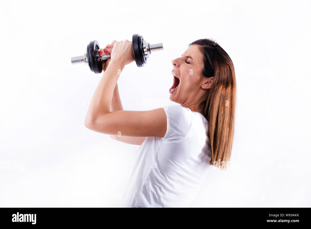 Screaming woman lifting weight Stock Photo - Alamy