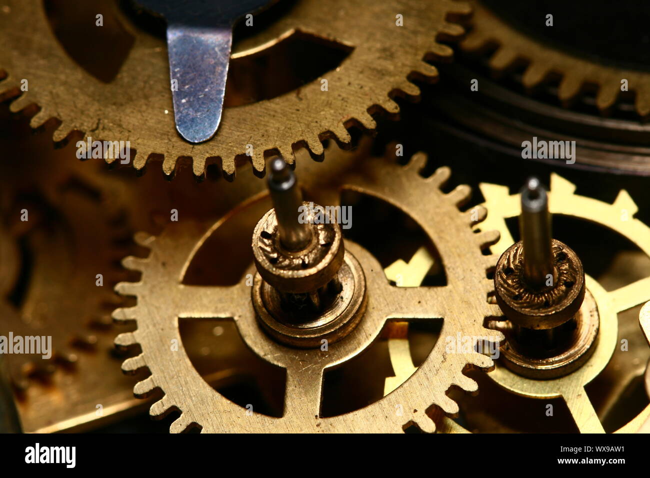 time gear inside my rare clock Stock Photo - Alamy