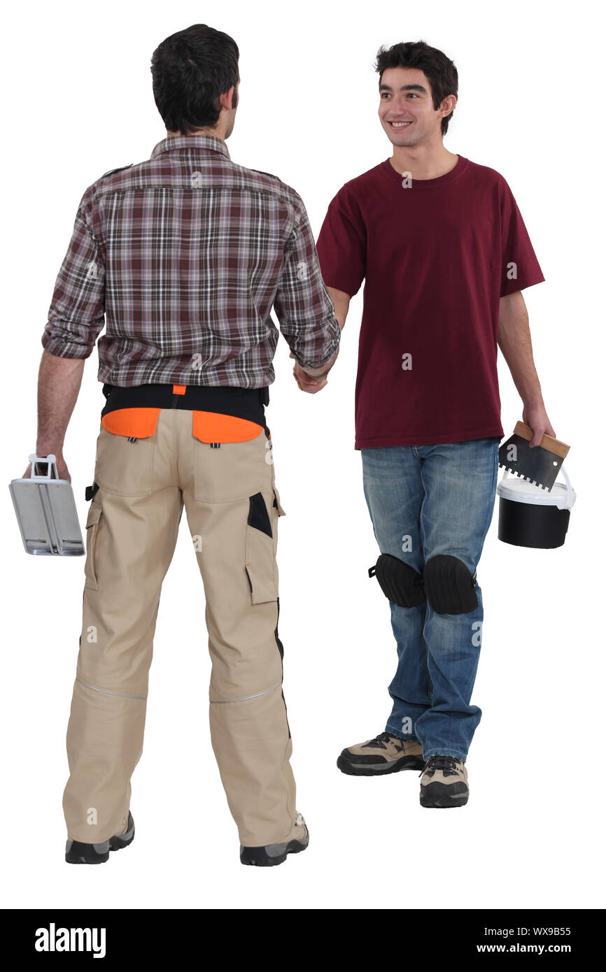 Construction workers greeting Stock Photo - Alamy