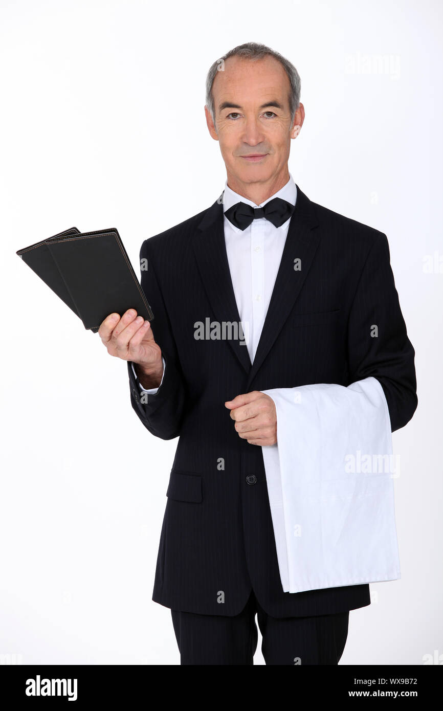 waiter bringing the menus Stock Photo - Alamy
